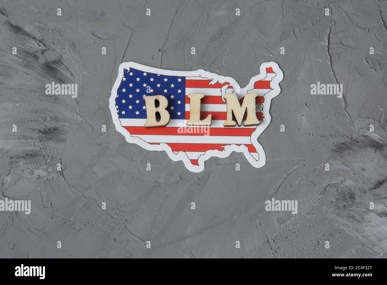 BLM word on a gray background with american flag. Fight against racism ...