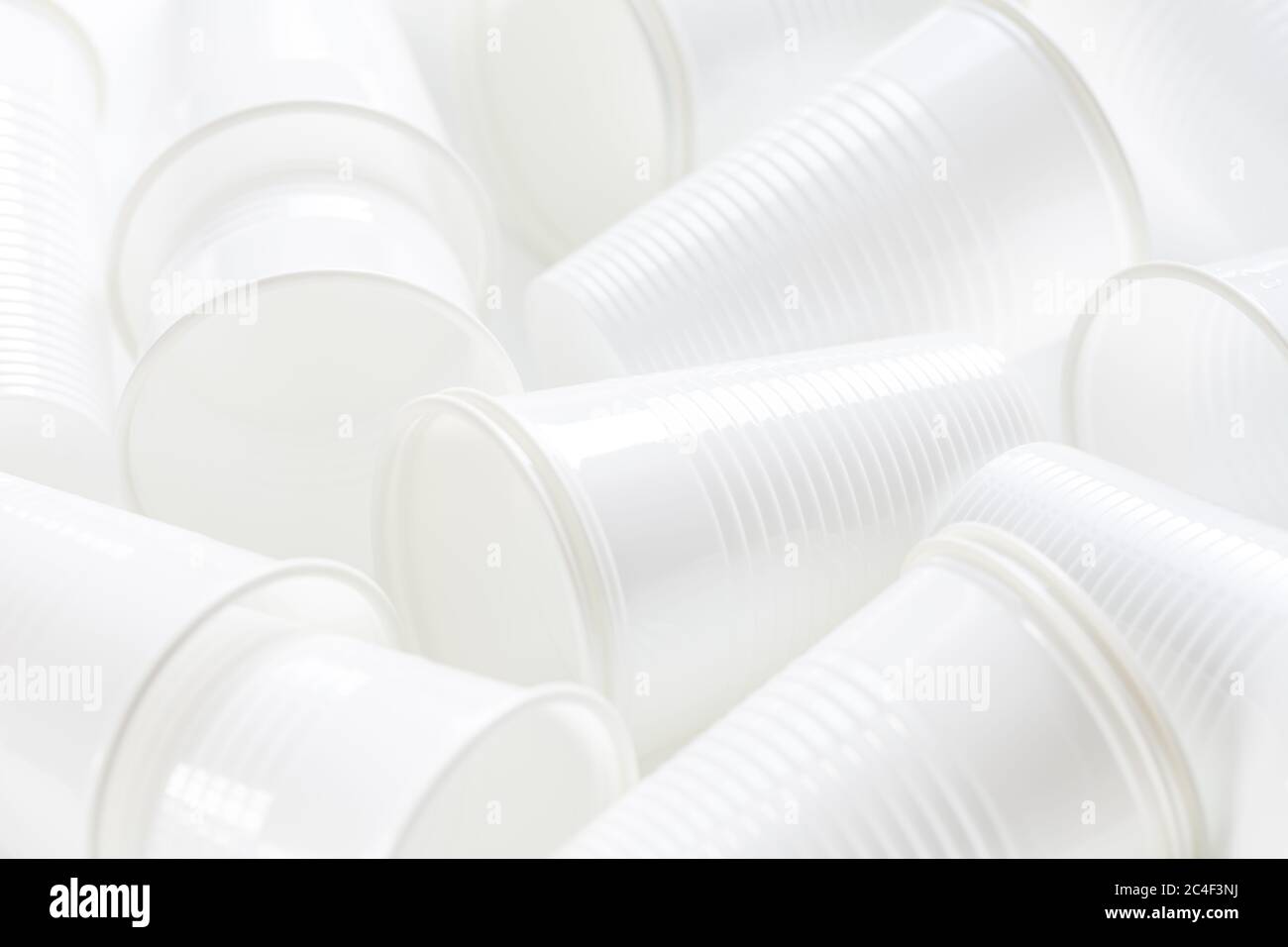 Disposable white plastic cups as background. Environmental concept. Non ...