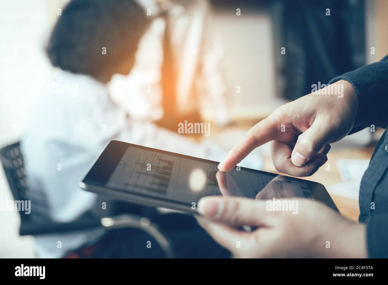 Business people examining financial reports and analyzing business ...