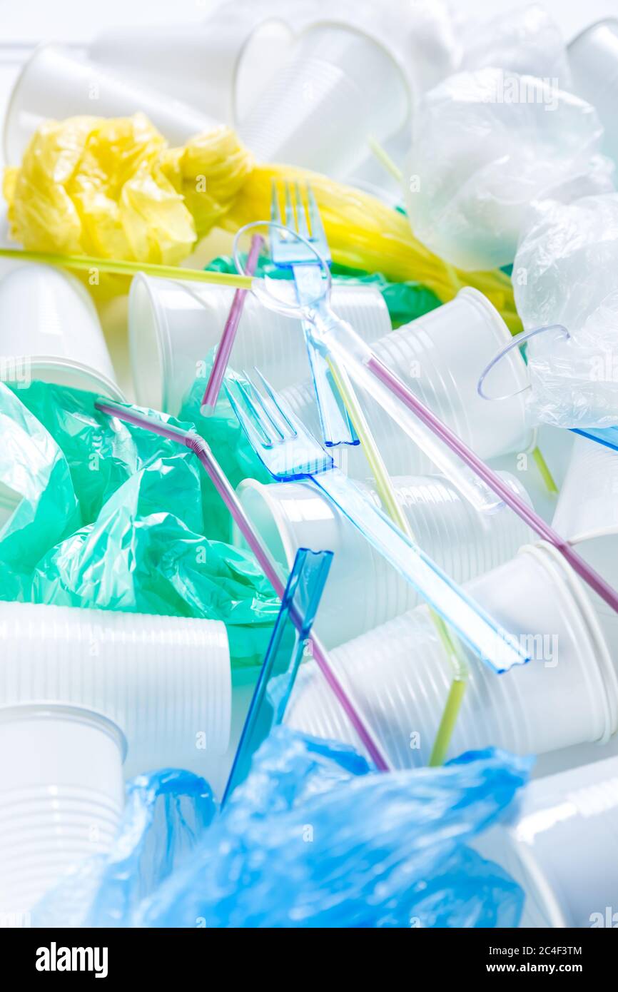 Assortment of disposable plastic, cups, cutlery, bags and drinking ...