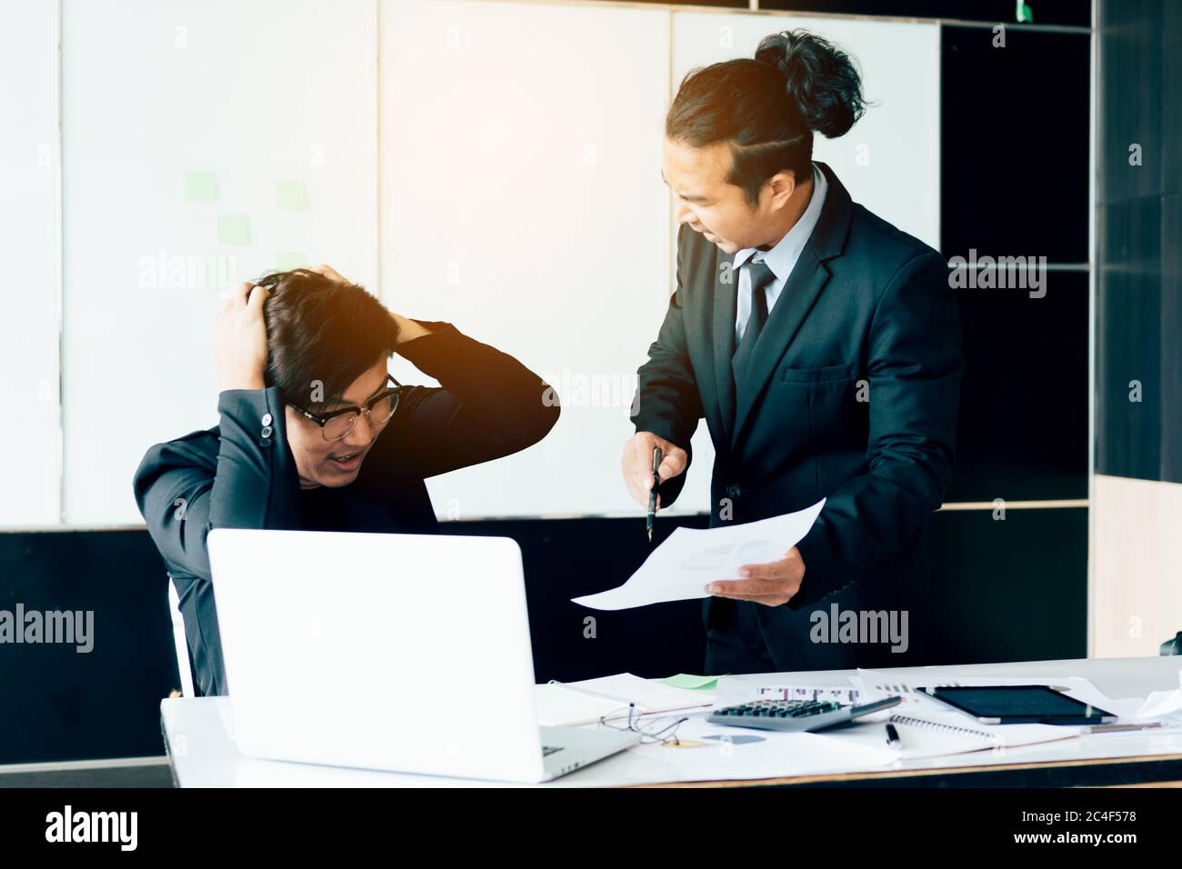 Boss shouting to employee while mistake working Stock Photo - Alamy
