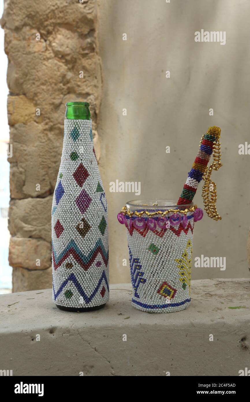 Sindhi artisan handicrafts: beaded casings for bottle and mortar and ...