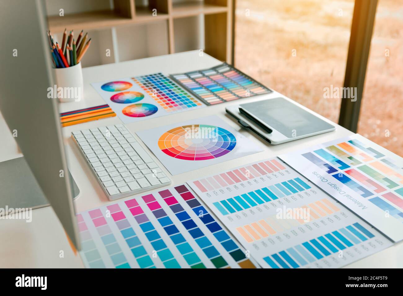 Designer's equipment is placed on the desk Stock Photo - Alamy