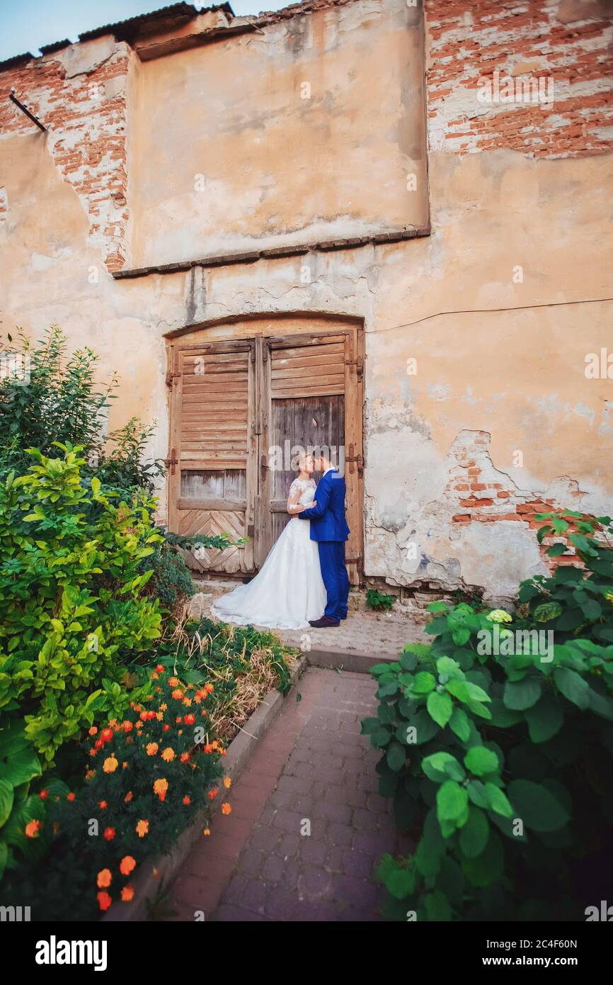 bride and groom walk around the old town Stock Photo - Alamy