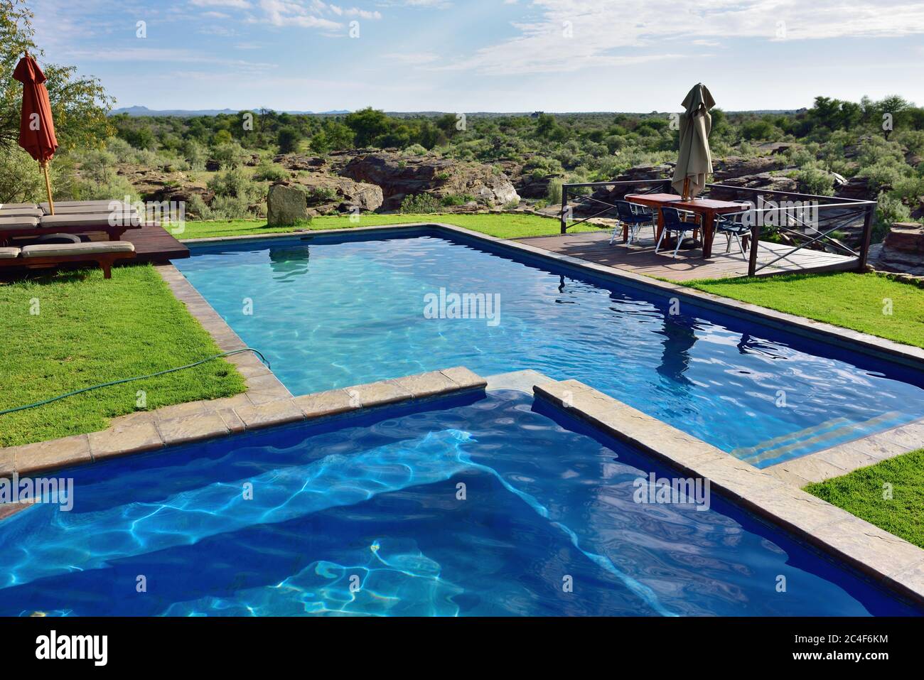 Swimming pool in african savannah. Namibia Stock Photo - Alamy