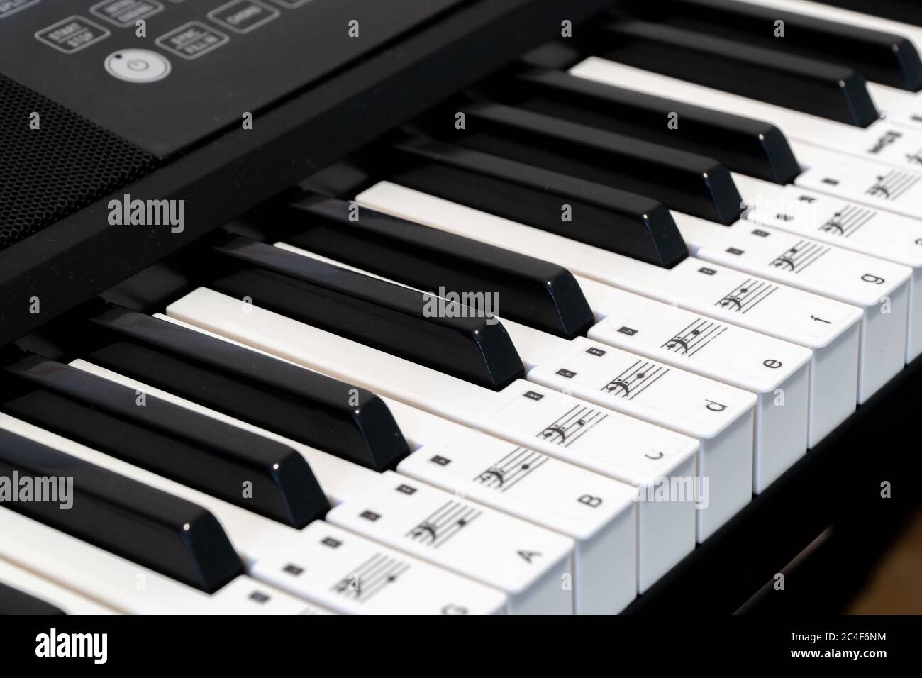 Piano side view with keys lost in the light Stock Photo - Alamy