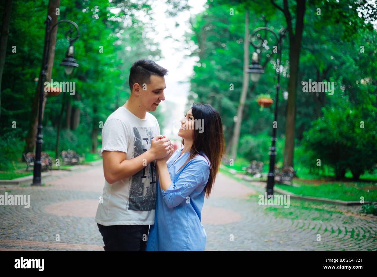 Couple in a forest, warm summer, lovely weather Stock Photo - Alamy
