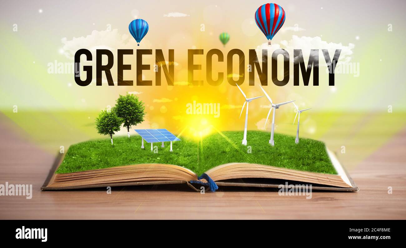 Open book with GREEN ECONOMY inscription, renewable energy concept ...