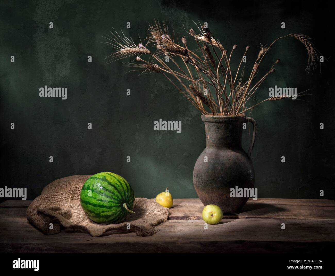 still life still life with one small whole green watermelon, two peers ...