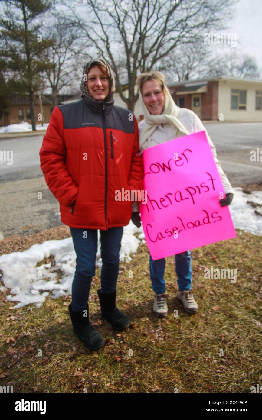 Women workers hold up sign hi-res stock photography and images - Alamy