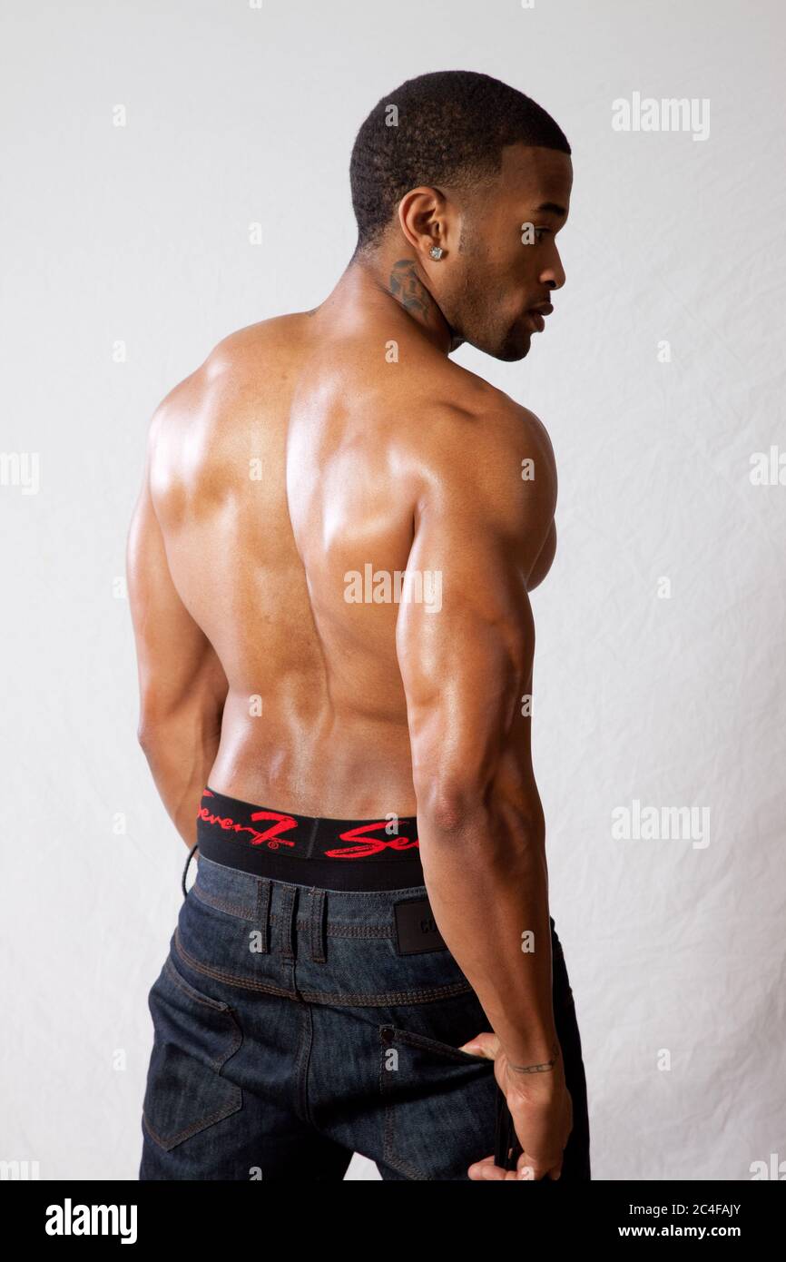 Strong black man showing his muscular back Stock Photo - Alamy