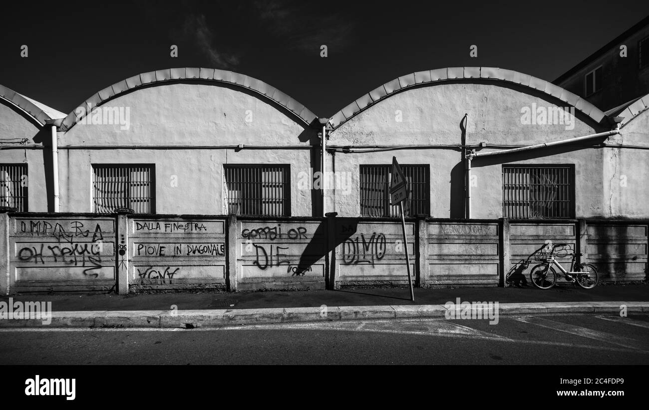 Old factory with arched-roofed in southern suburbs of Milan, Italy ...