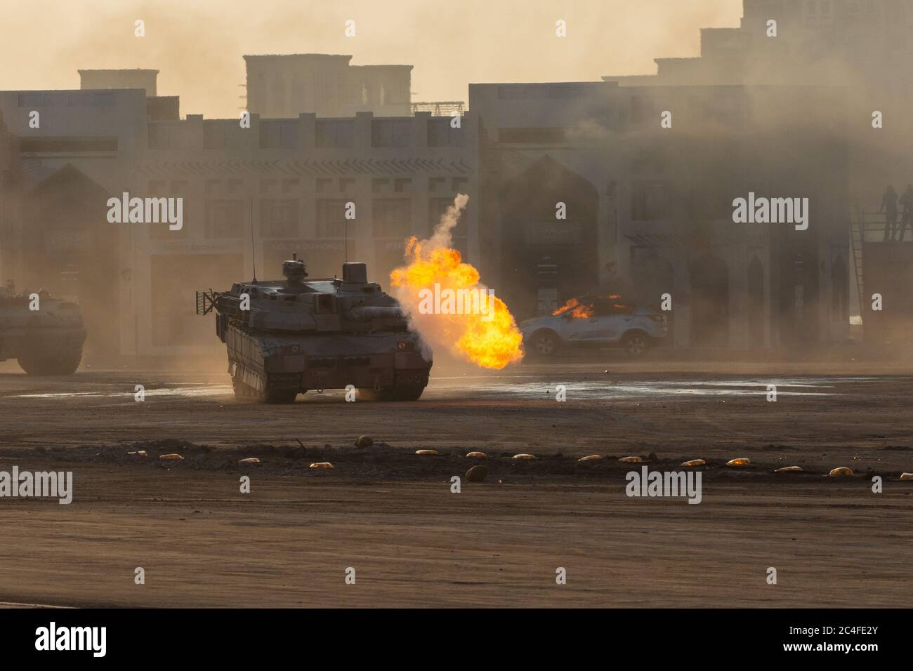 Military explosion, fighting, war and chaos. Tanks driving by through ...