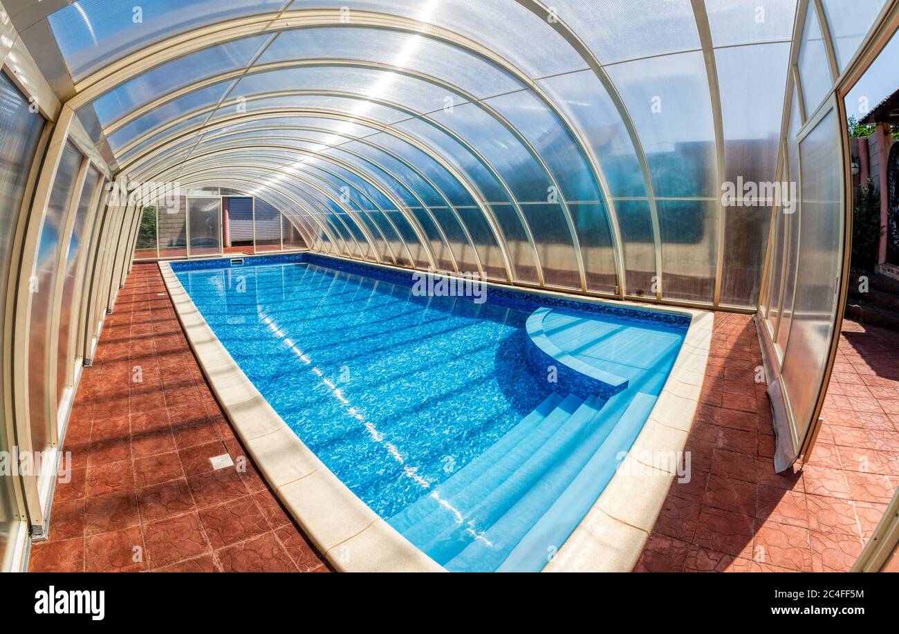 Covered summer pool. The covered area of the outdoor pool for hotel ...