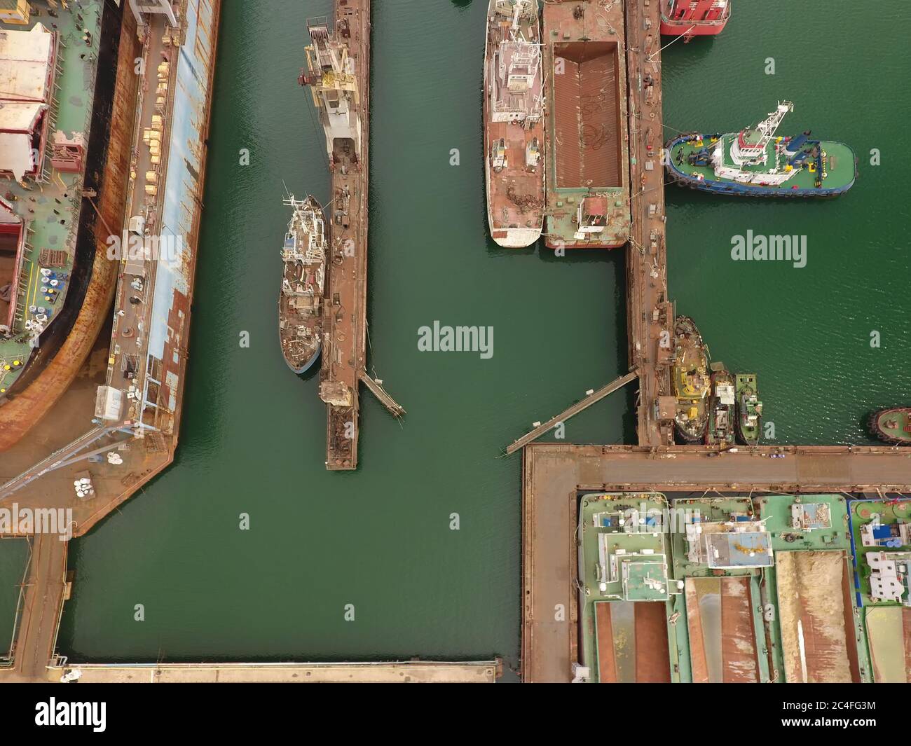 boats in mooring. repair vessels hull (ship, tanker) in shipyard Stock ...