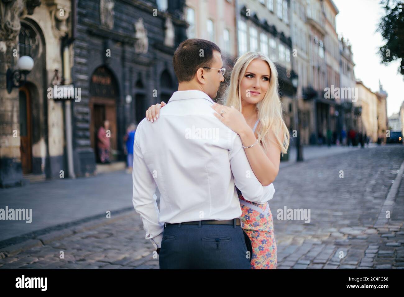 Romantic tourist couple walking around the city relaxing Stock Photo ...