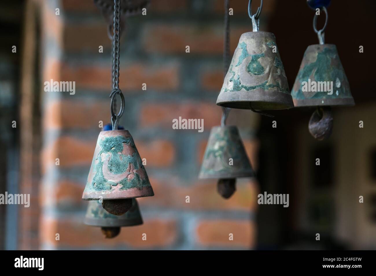 Old metal bell wind chime Stock Photo - Alamy