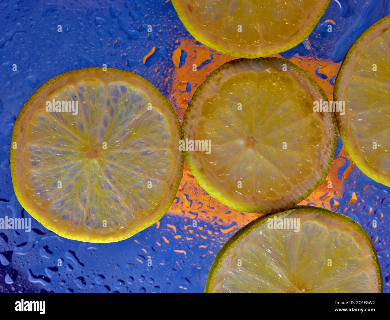 Sliced lime patterns and water droplets on a hard surface Stock Photo ...