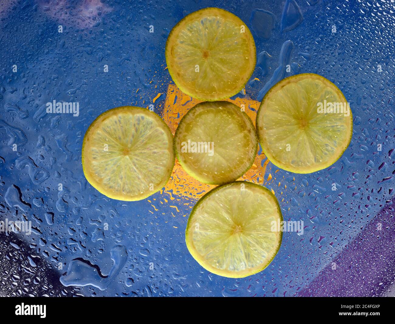 Sliced lime patterns and water droplets on a hard surface Stock Photo ...