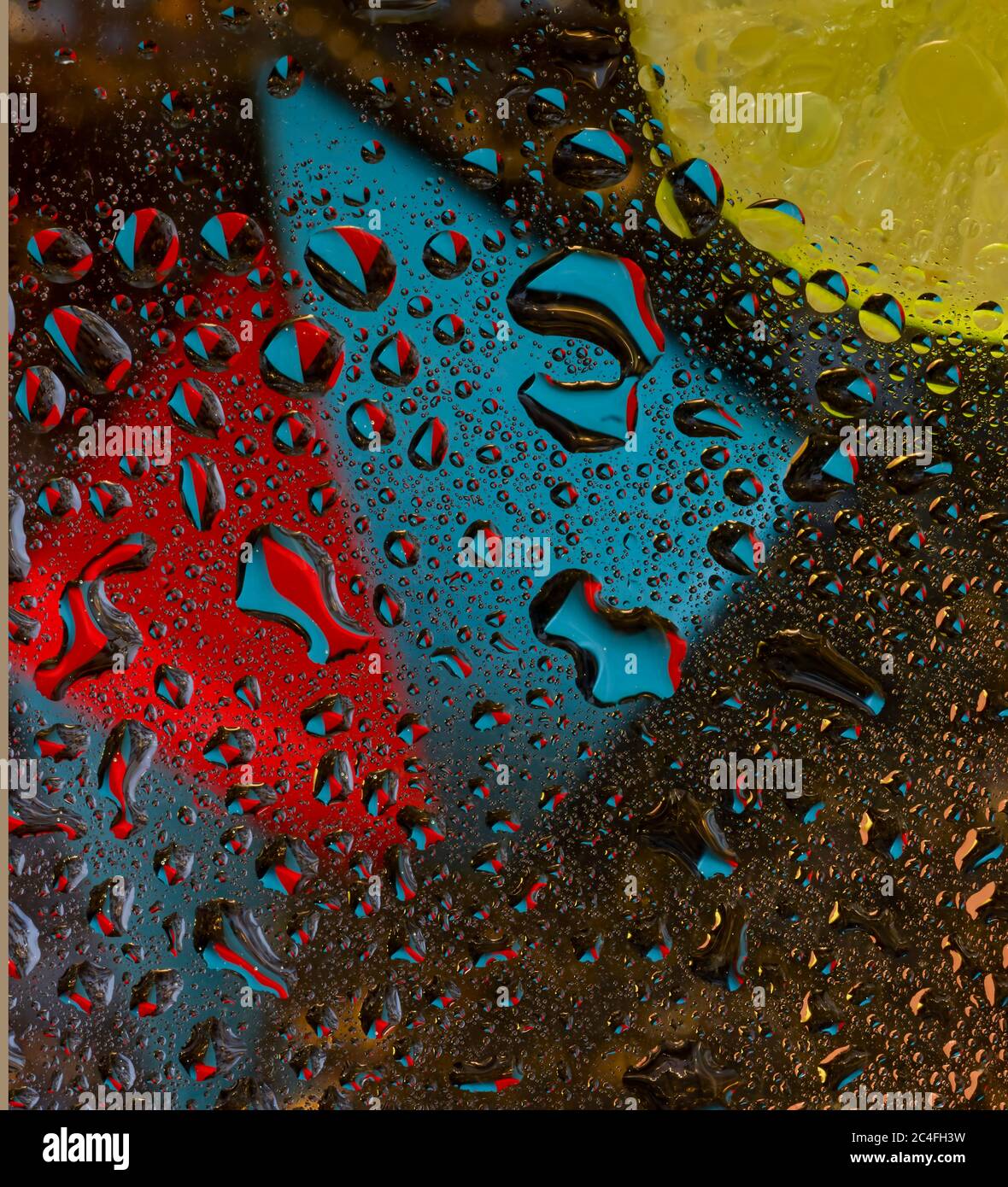 Red accent colour of water droplets on a hard surface Stock Photo - Alamy