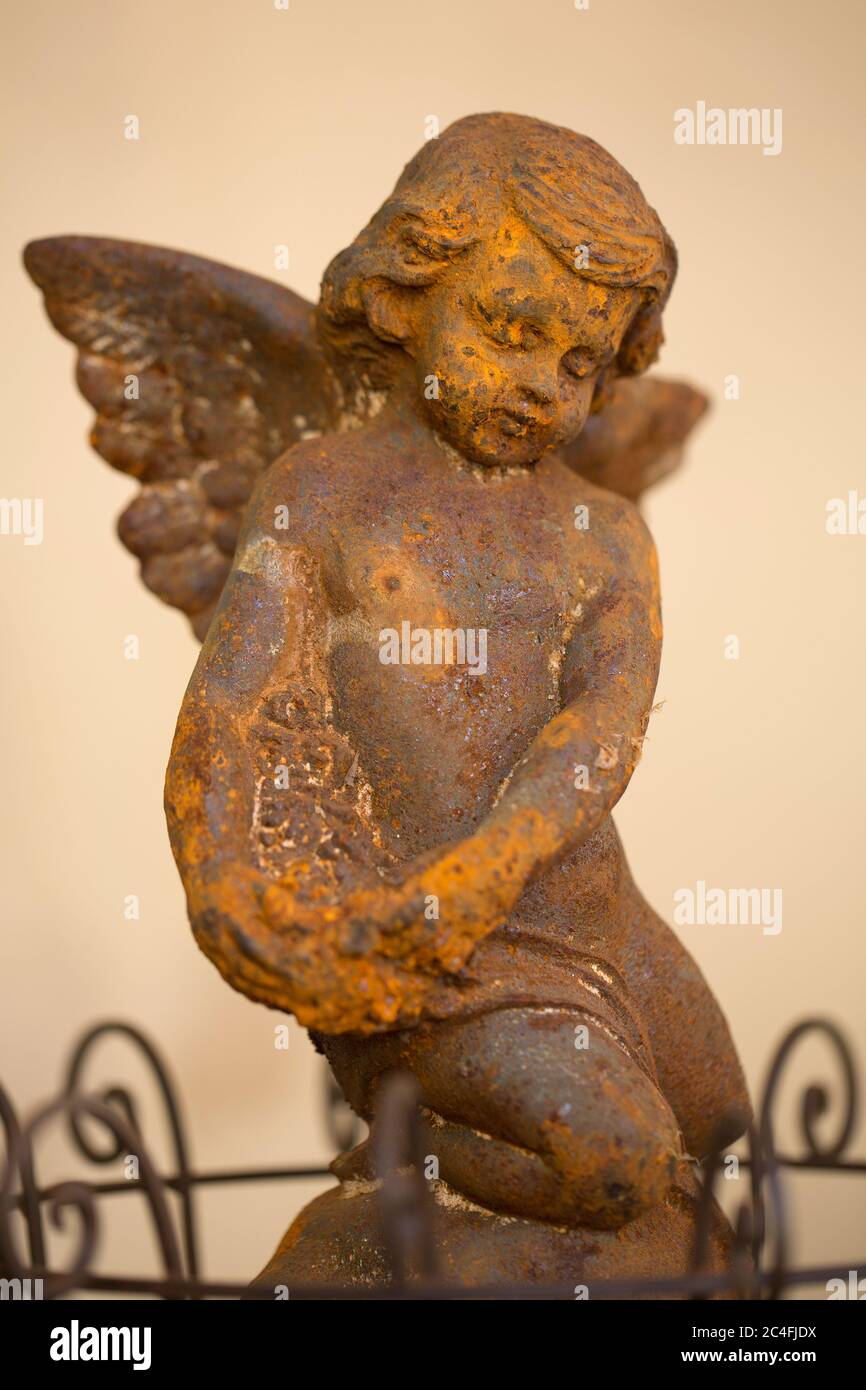 Old rusty iron angel figurine Stock Photo - Alamy