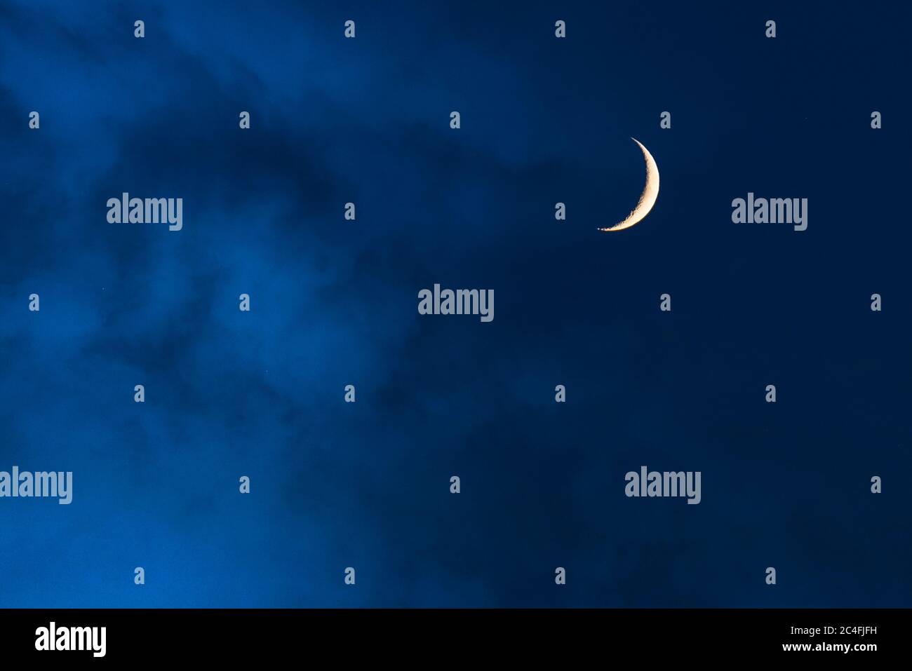 Blue foggy sky with crescent or half moon Stock Photo - Alamy