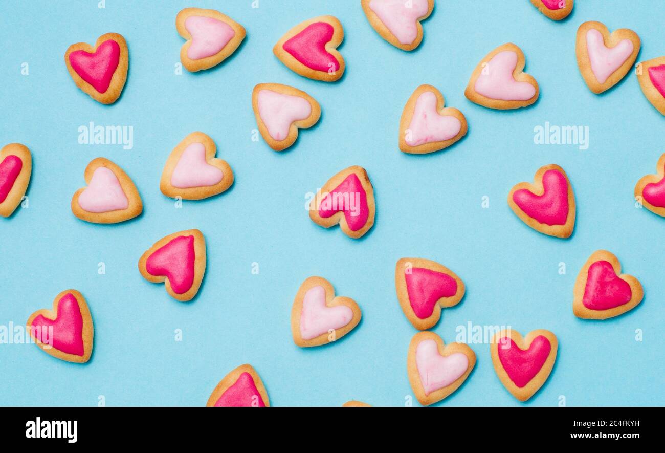 Heart shape cookies for Valentines Day on blue background. Top view ...