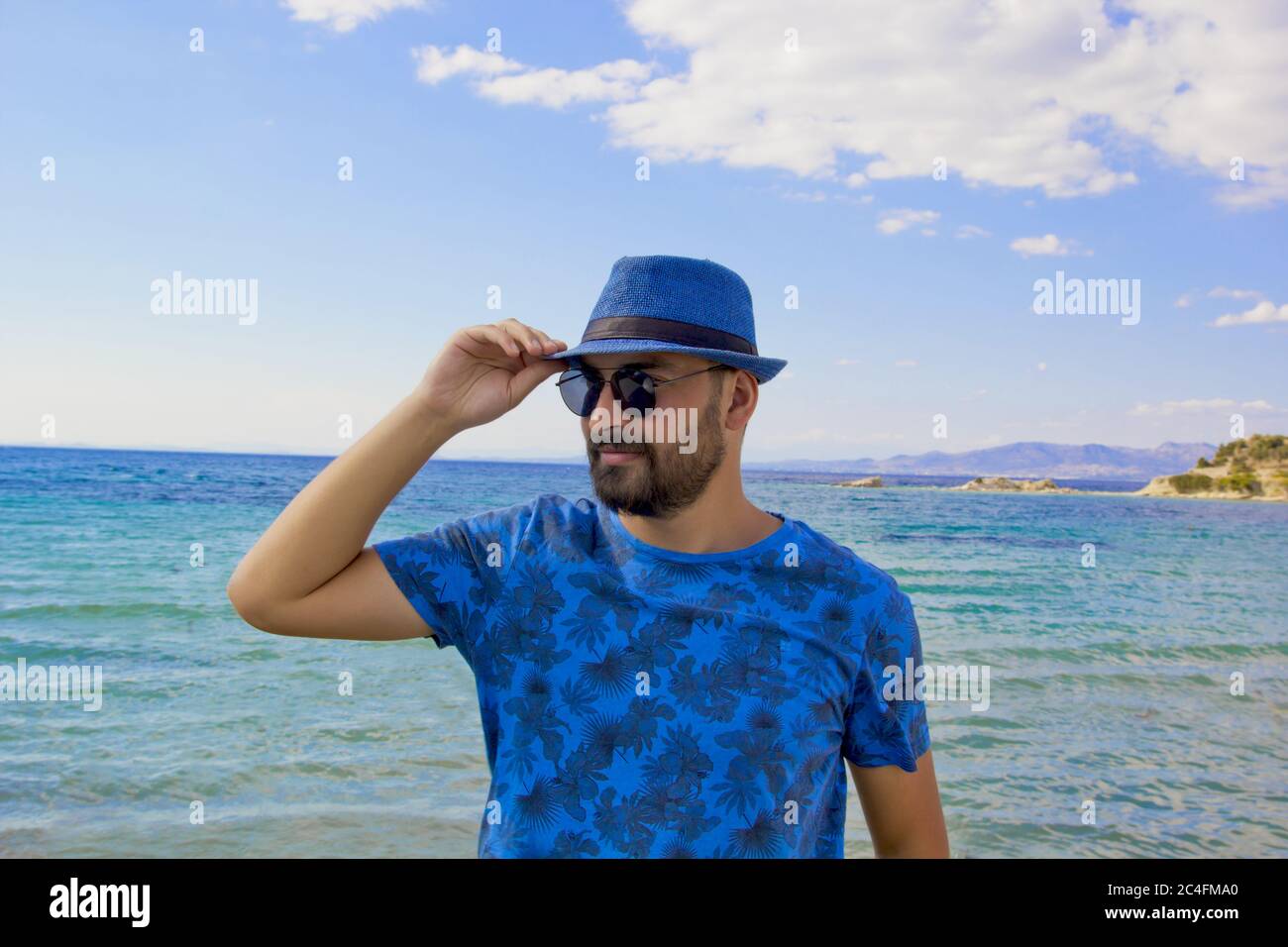 Man with blue hat hi-res stock photography and images - Alamy