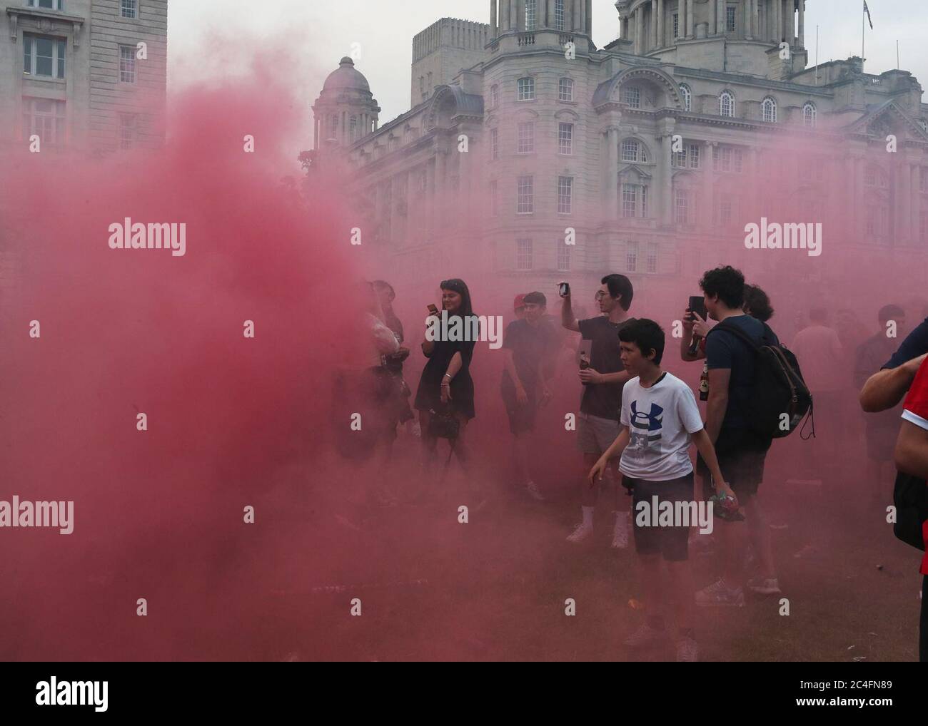 Liverpool fans let off flares outside the Liver Building in Liverpool ...