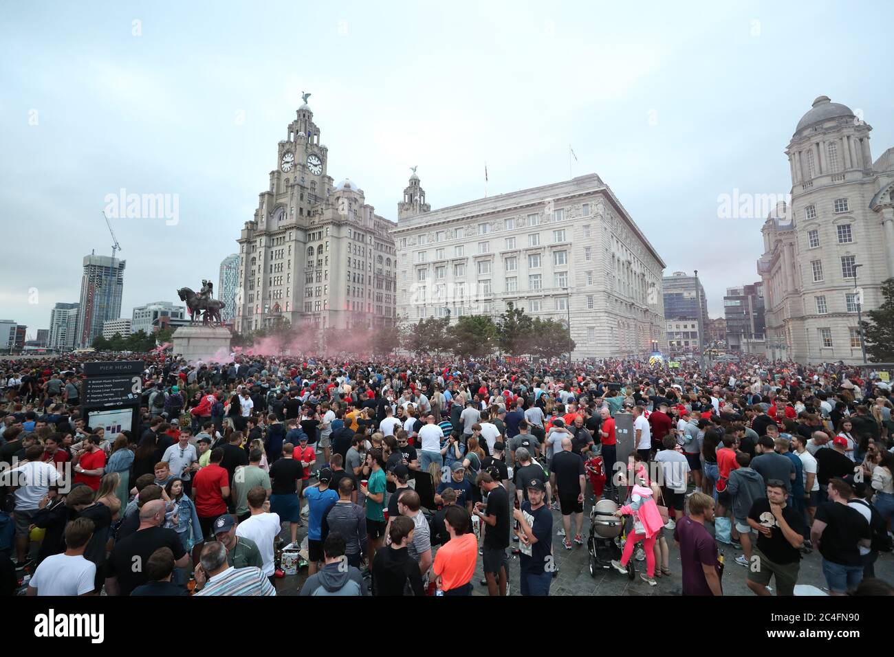 Liverpool fans let off flares outside the Liver Building in Liverpool ...