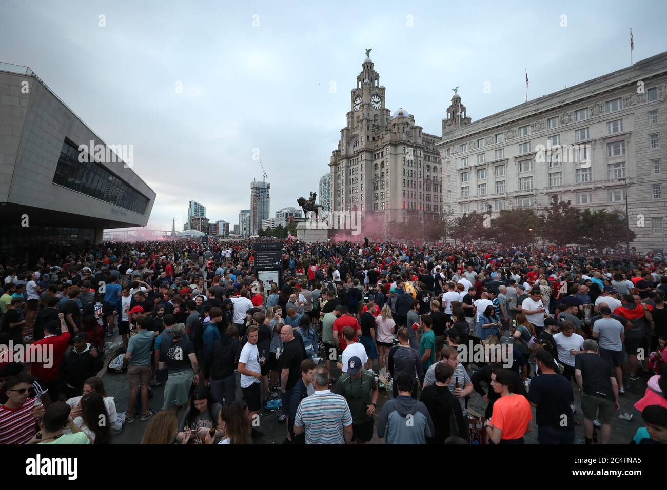 Liverpool fans let off flares outside the Liver Building in Liverpool ...