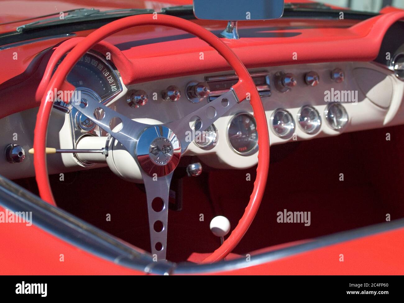 vintage red chevrolet corvette 56, on historic route 66, in front of ...