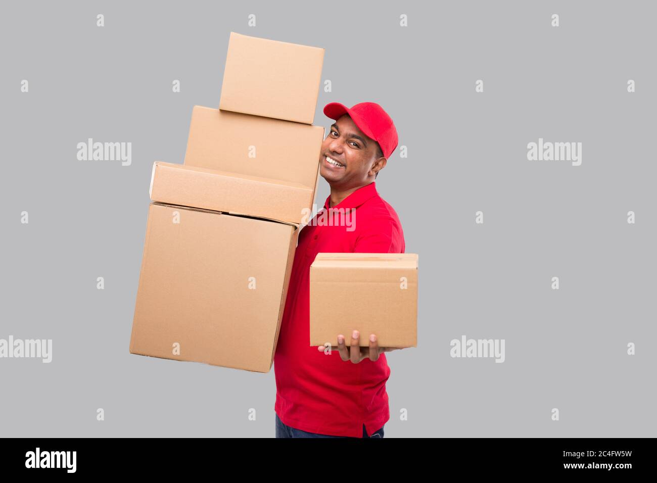 Delivery Man Holding a lot Carton Boxes Isolated. Indian Delivery Boy ...