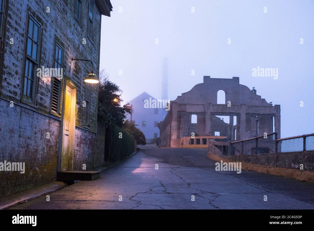 Alcatraz prison at dusk with buildings in ruins and fog Stock Photo - Alamy