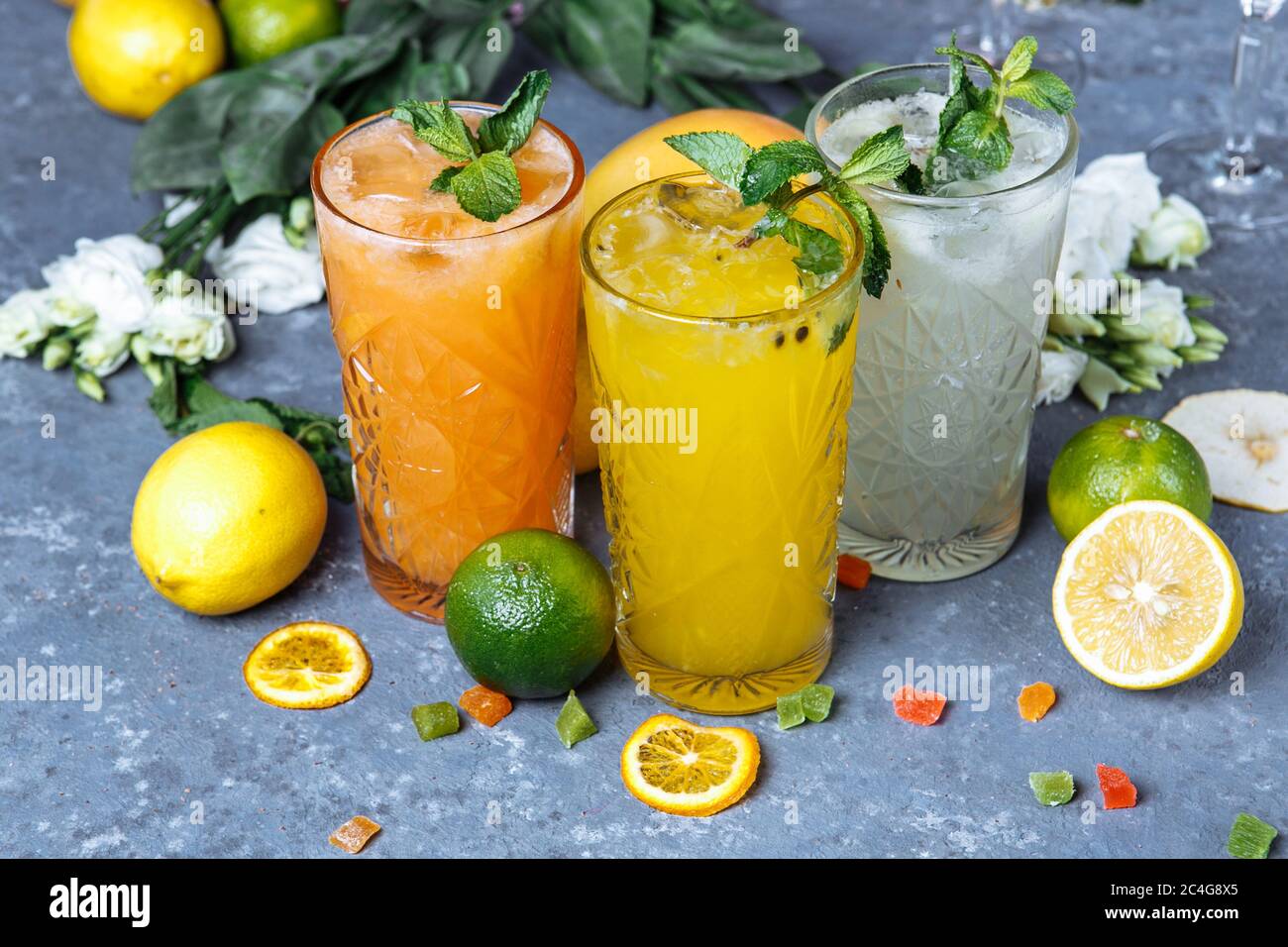 Summer fresh cold drink beverages. Ice Lemonade in the jug and lemons ...