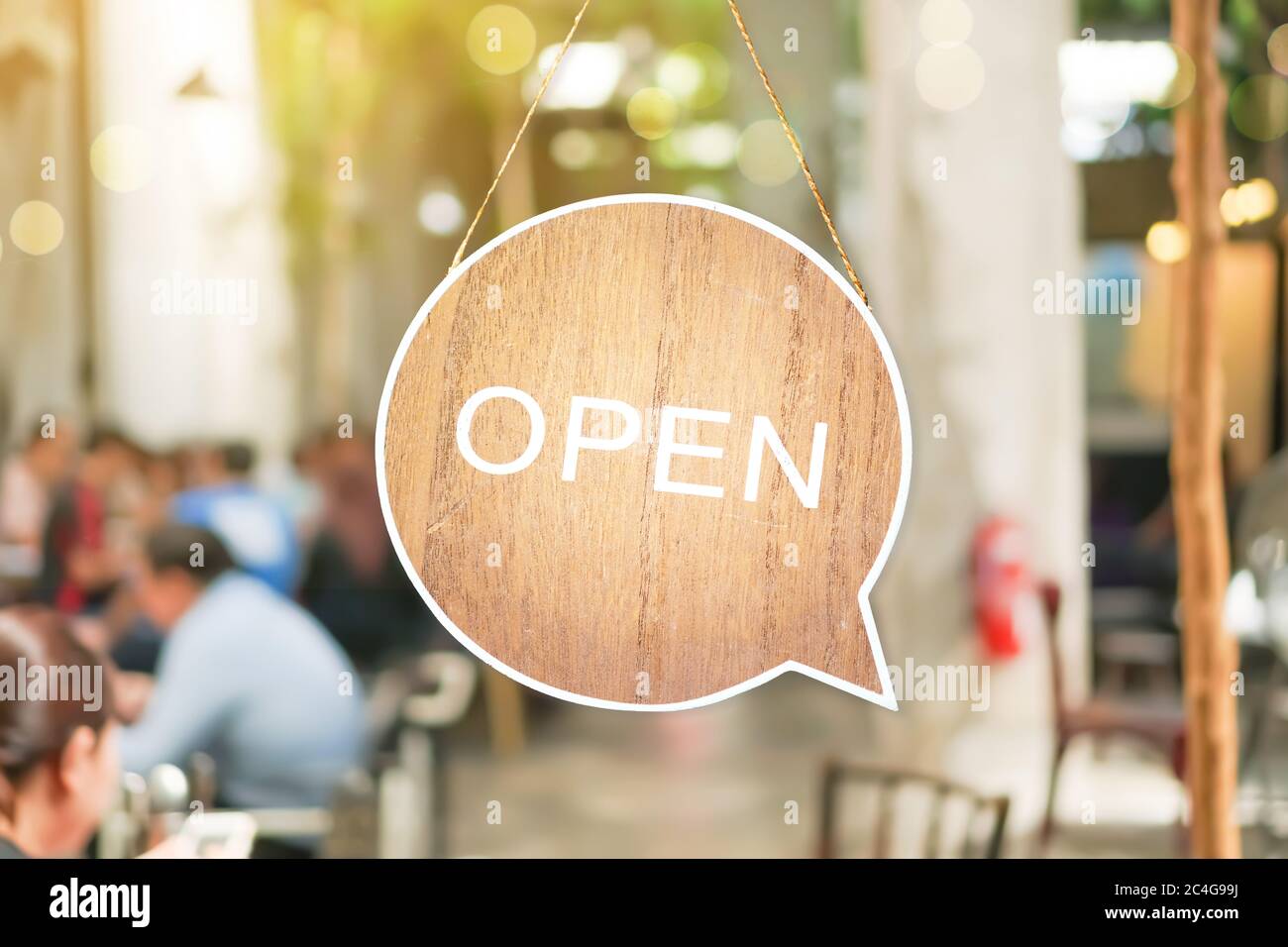 A business sign that says open on cafe or restaurant hang on door at ...