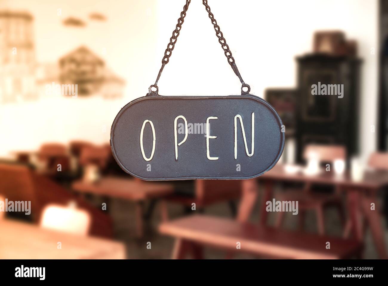 A business sign that says open on cafe or restaurant hang on door at ...
