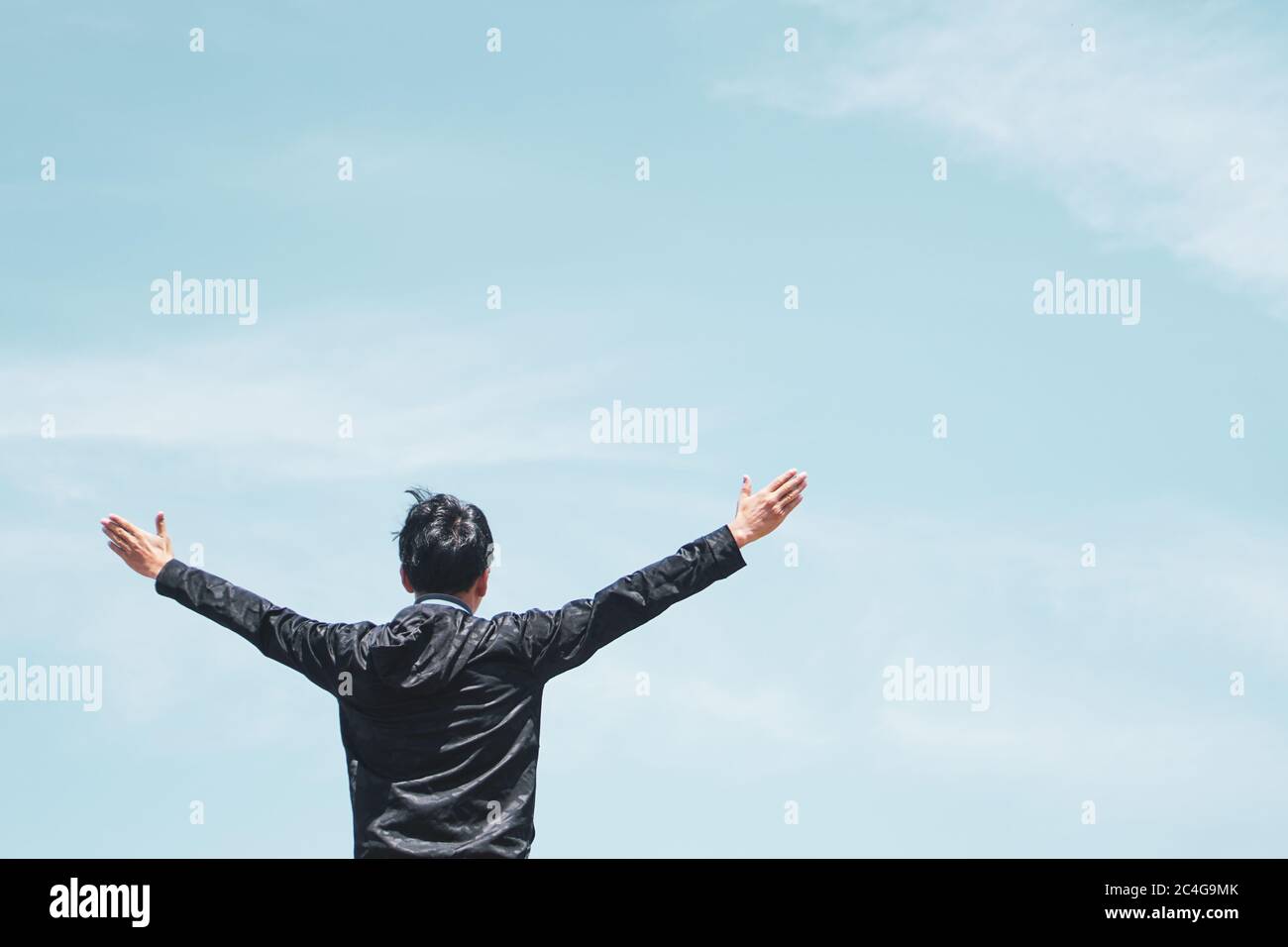 Man rise hands up to sky metaphor freedom concept with sunset sky ...