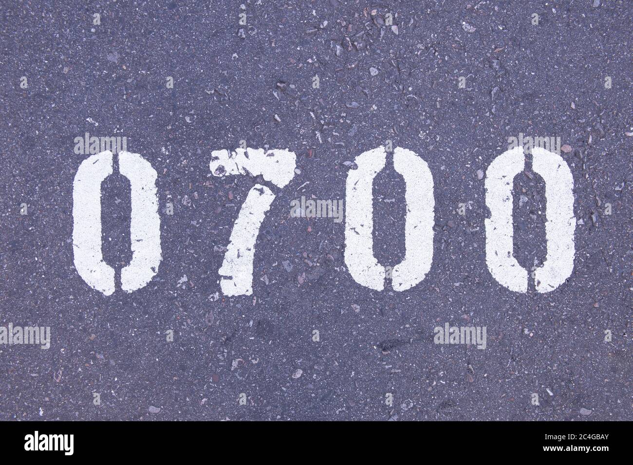 Number 1650 stenciled on the asphalt in white paint Stock Photo - Alamy