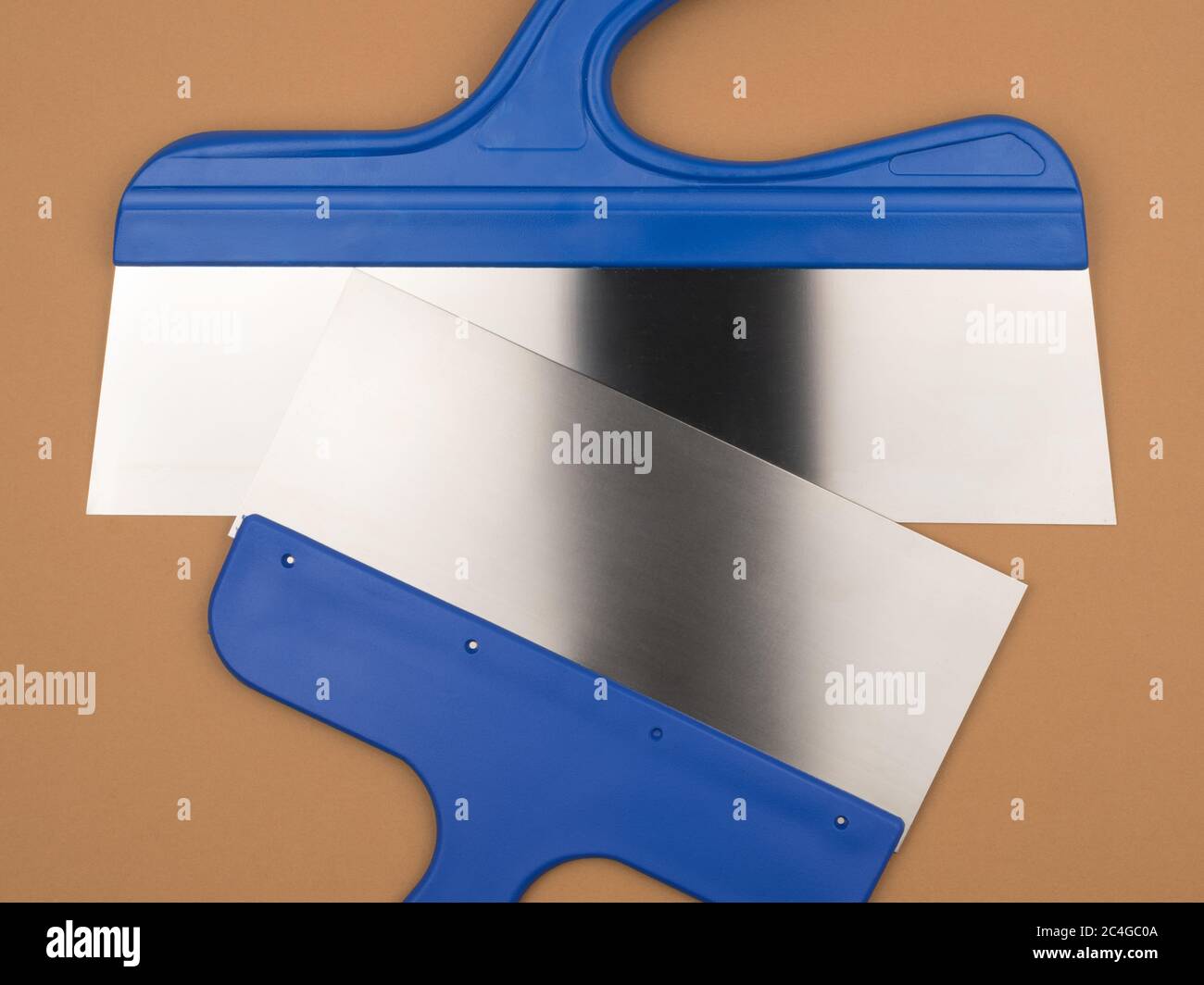Plasterer spatula. Beige background. Building tool. The tool of the ...