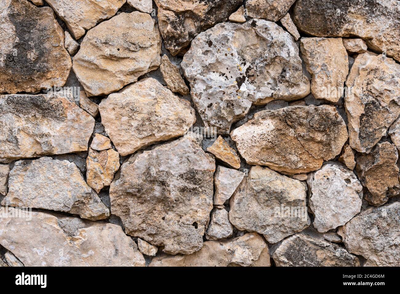 Background of limestone masonry. The surface is decorated with natural ...