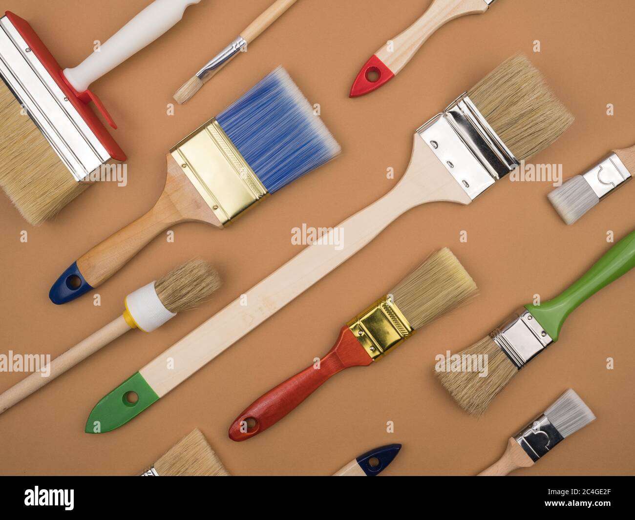 Building tool. Paint brushes. Beige background. The concept of repair ...