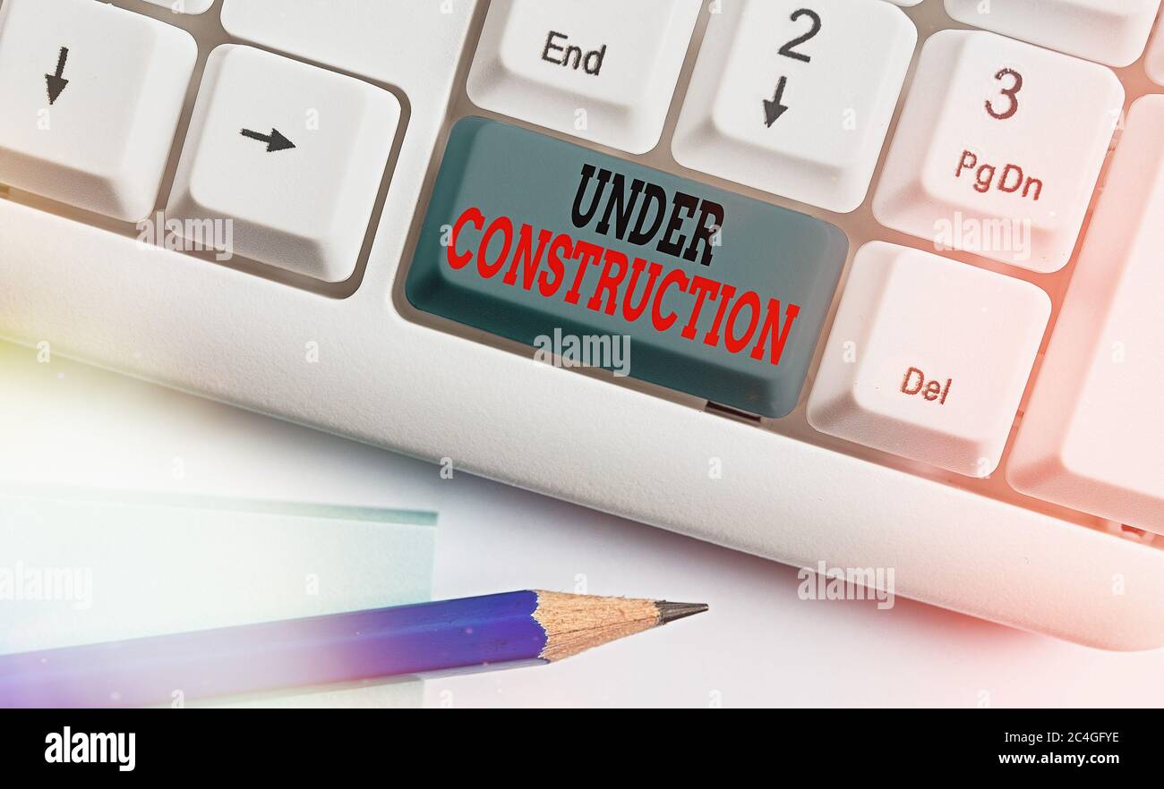 Writing note showing Under Construction. Business concept for building ...