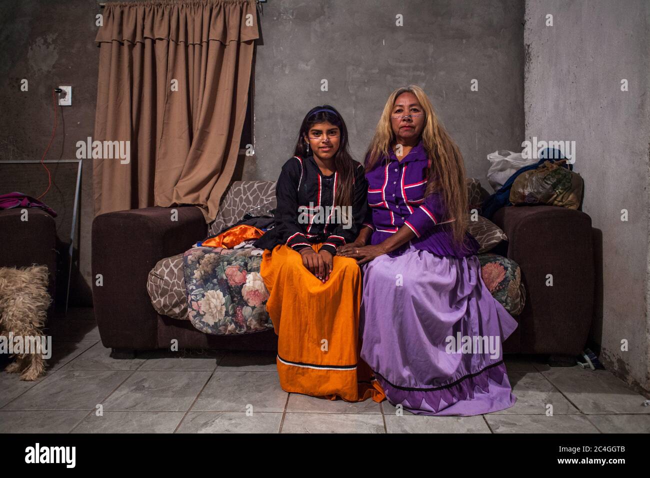 The celebrated girl from the Comcáac community sits with her godmother ...