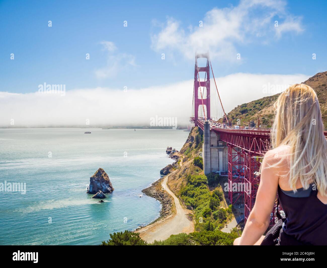 Blonde girl admires panorama from Golden Gate Bridge San Francisco ...