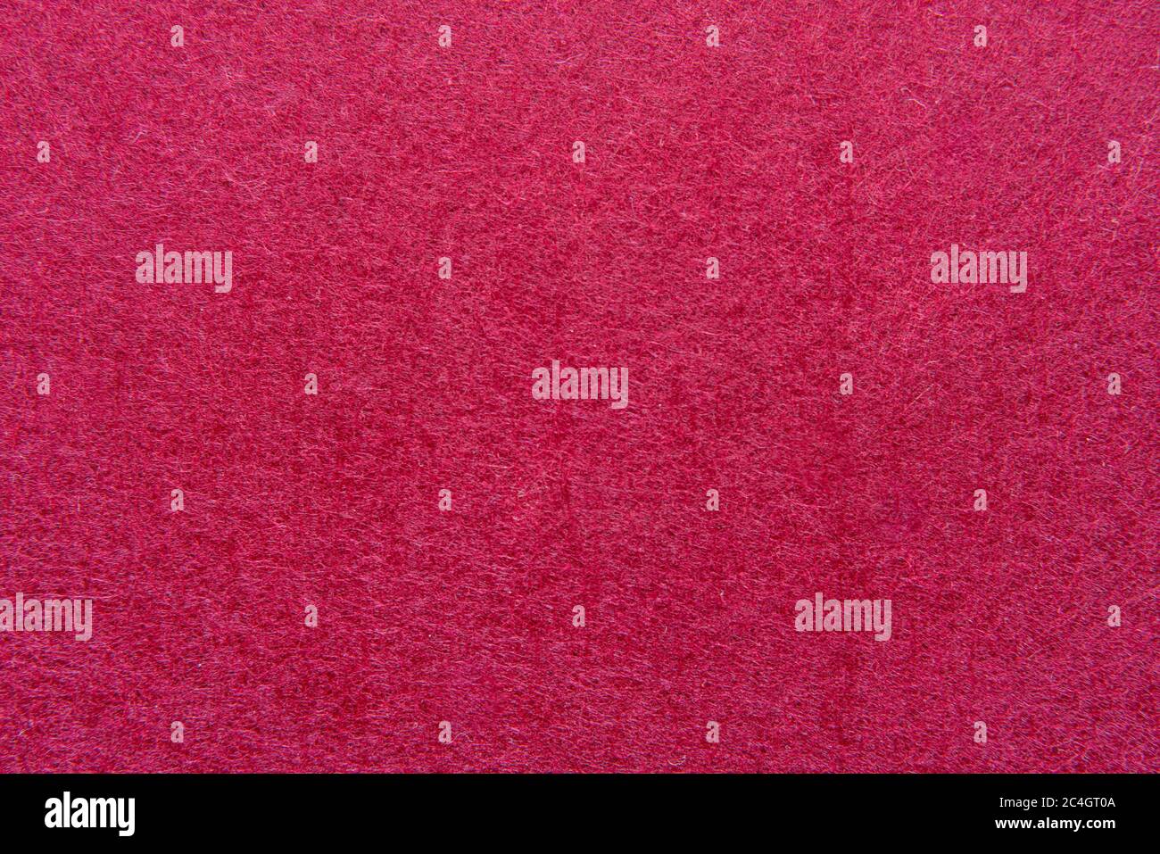 High resolution close up of bright raspberry felt fabric texture of ...