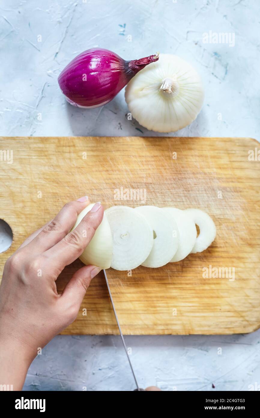 Cutting onions. Preparing salad, meal or dinner. Organic food Stock ...