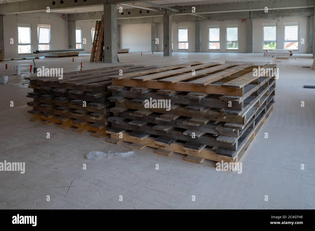 wooden pallets lying on the floor of a factory building on a ...