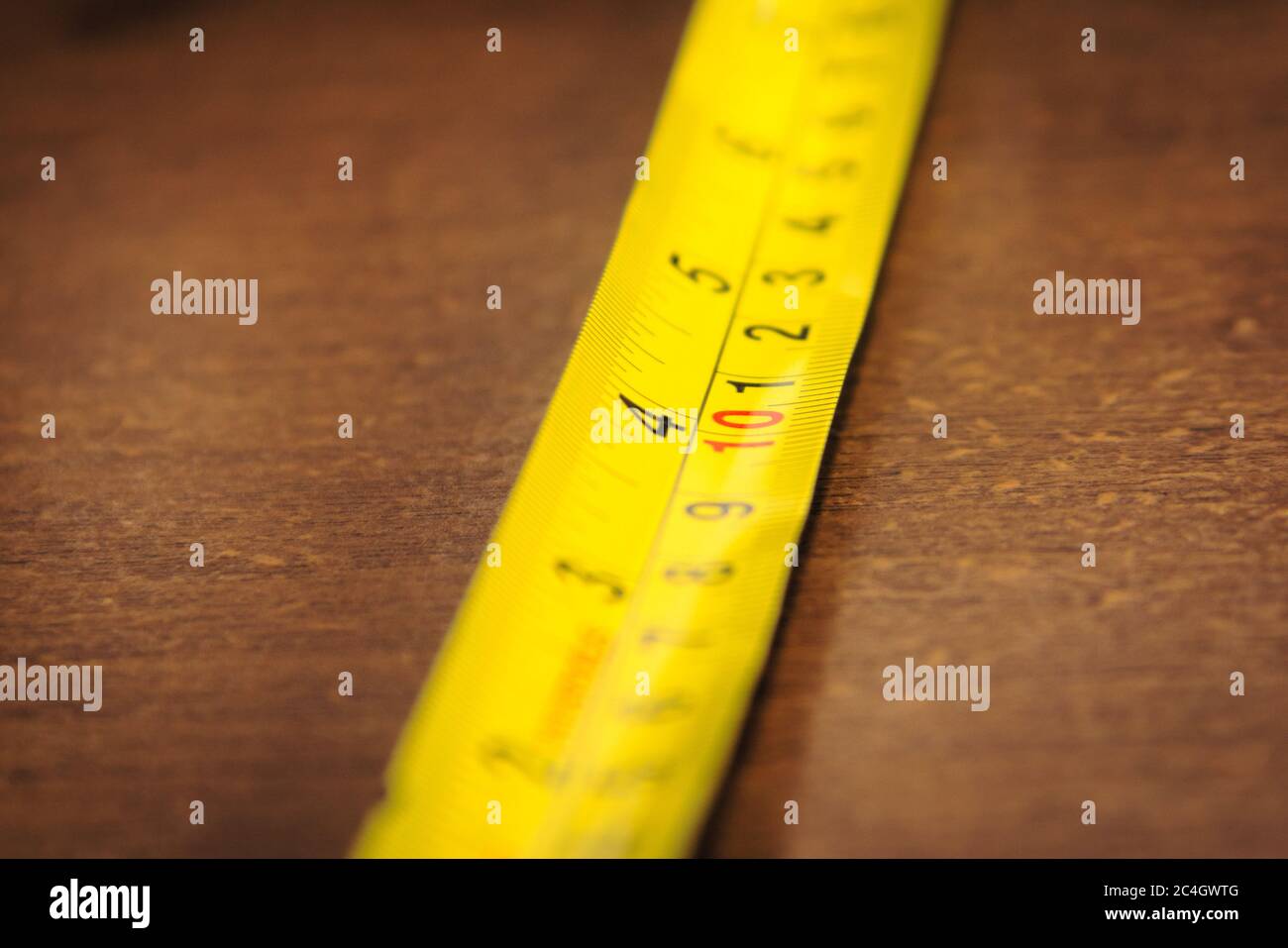 Yellow metallic measuring tape hi-res stock photography and images - Alamy