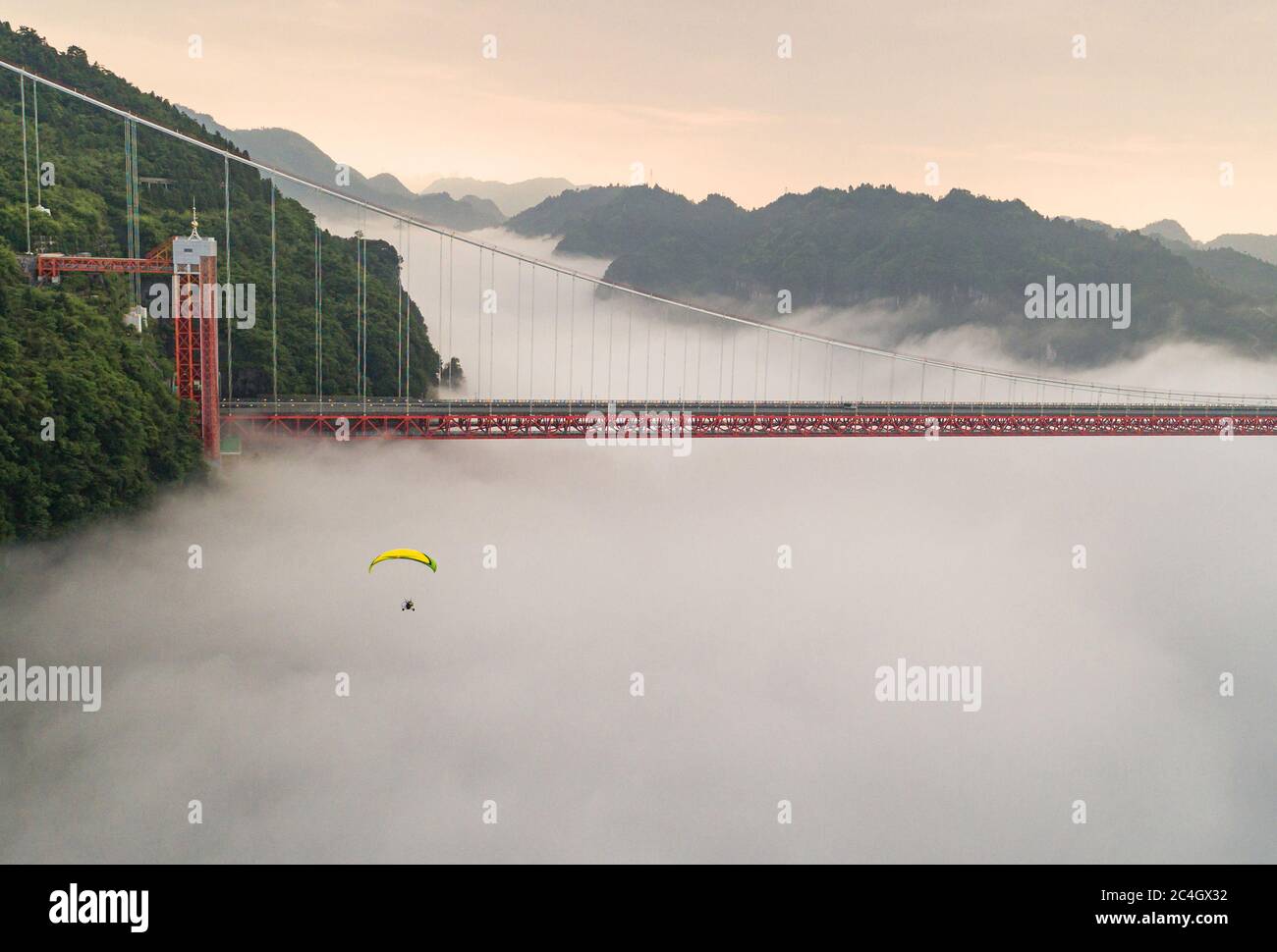 Beijing, China's Hunan Province. 26th June, 2020. A tourist flies a ...